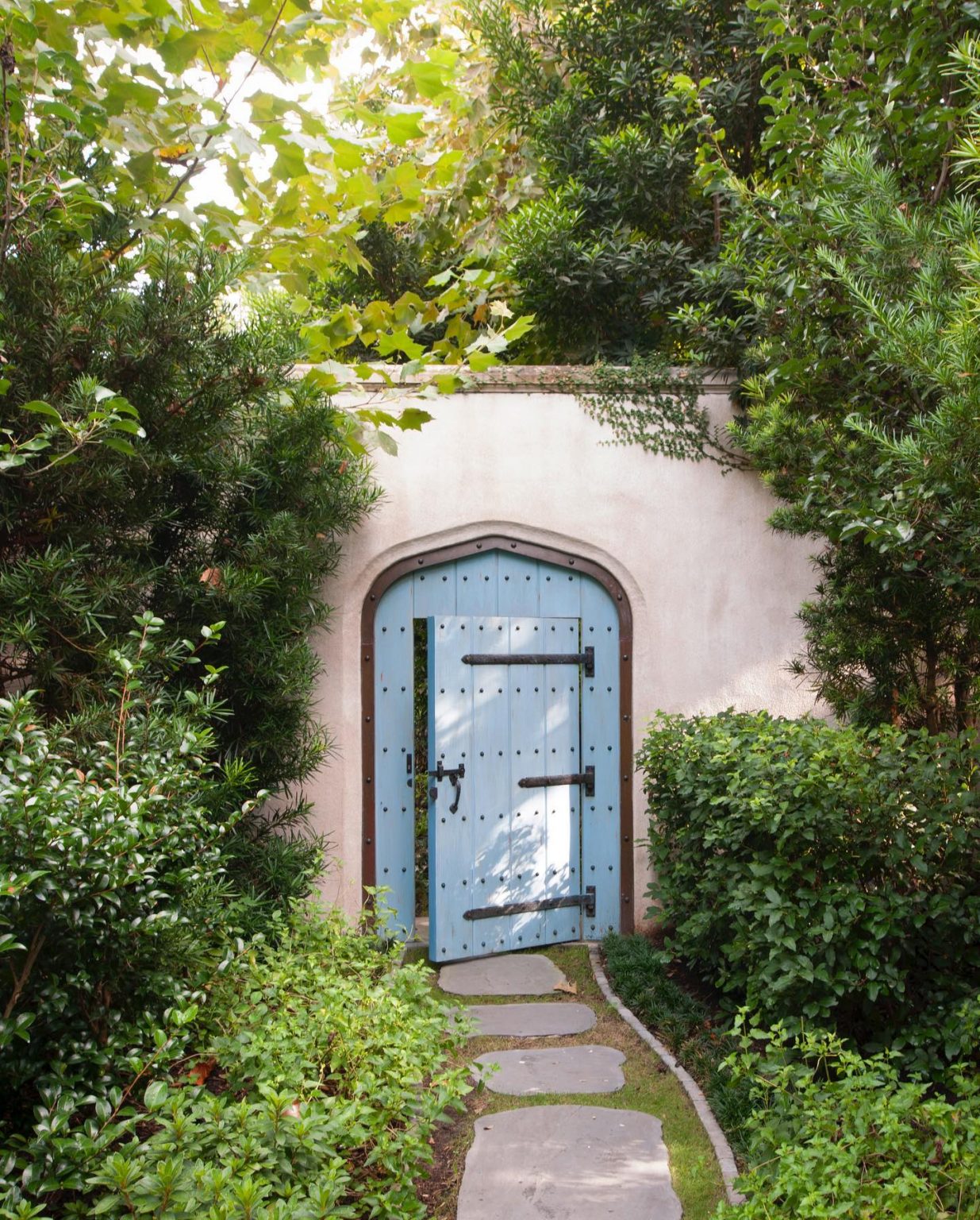 Secret Garden with a Blue Wall - Interiors By Color